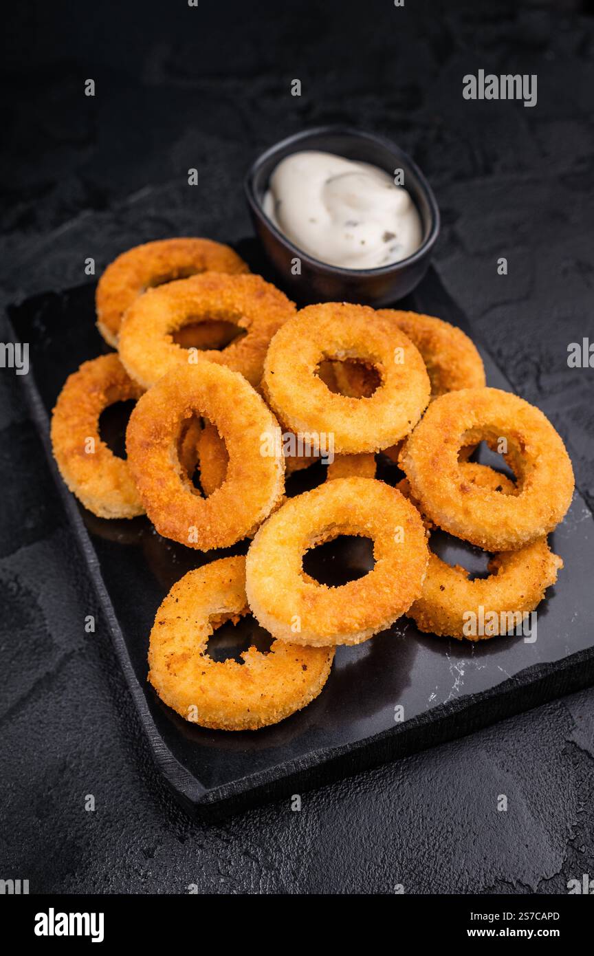 Deep fried squid rings with breading, calamari fastfood snack. black ...