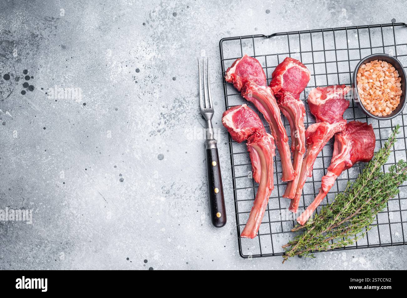 Raw lamb meat chops, fresh mutton cutlets. grey background. top view ...