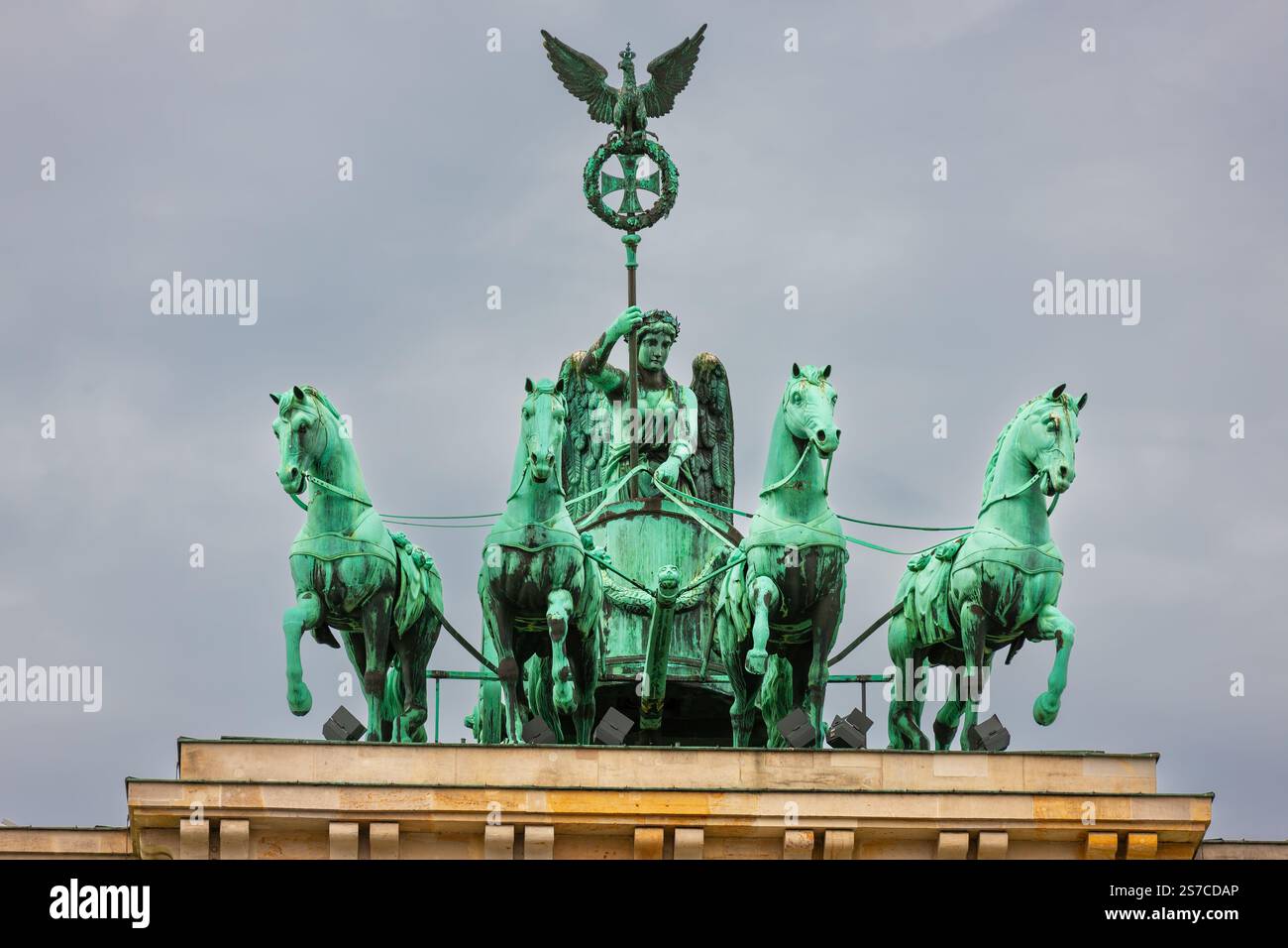 Bronze statue of a Quadriga, a chariot drawn by four horses, driven by ...
