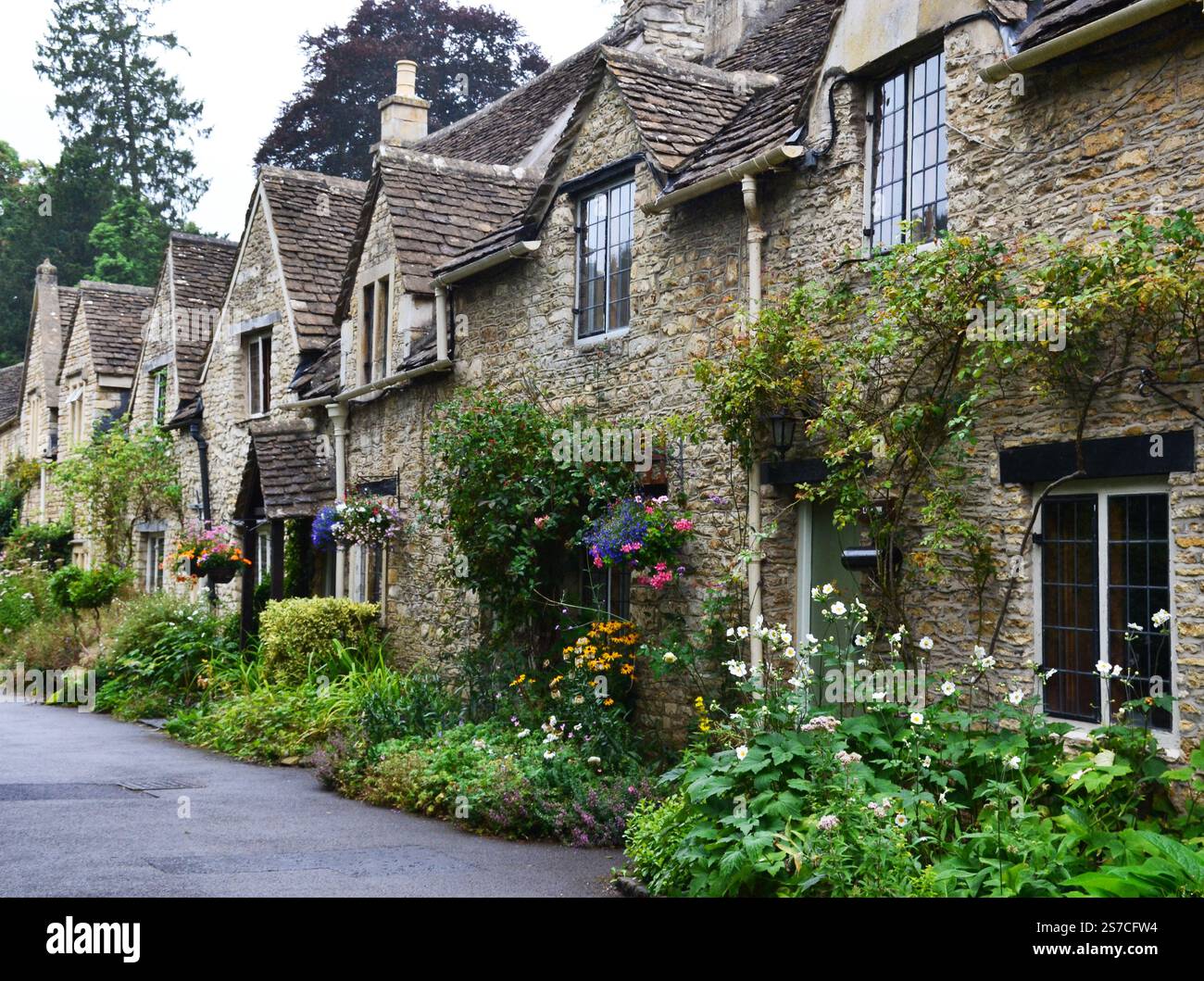 Old stone cottages in picturesque Castle Combe village, Costwolds ...