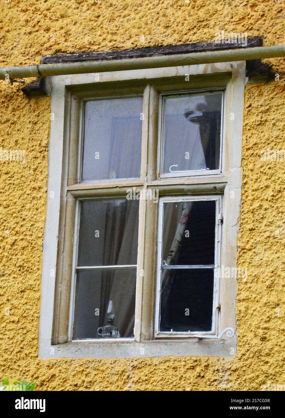Close up picture of a traditional wooden window of an old rural cottage ...