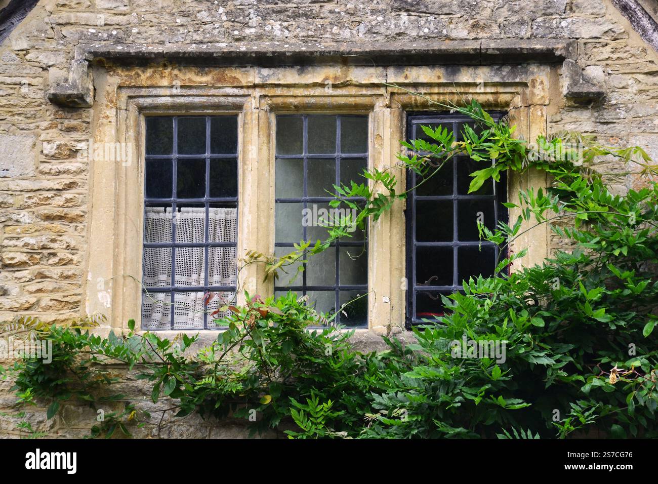 Close up picture of an old traditional wooden window with 3 vertical ...
