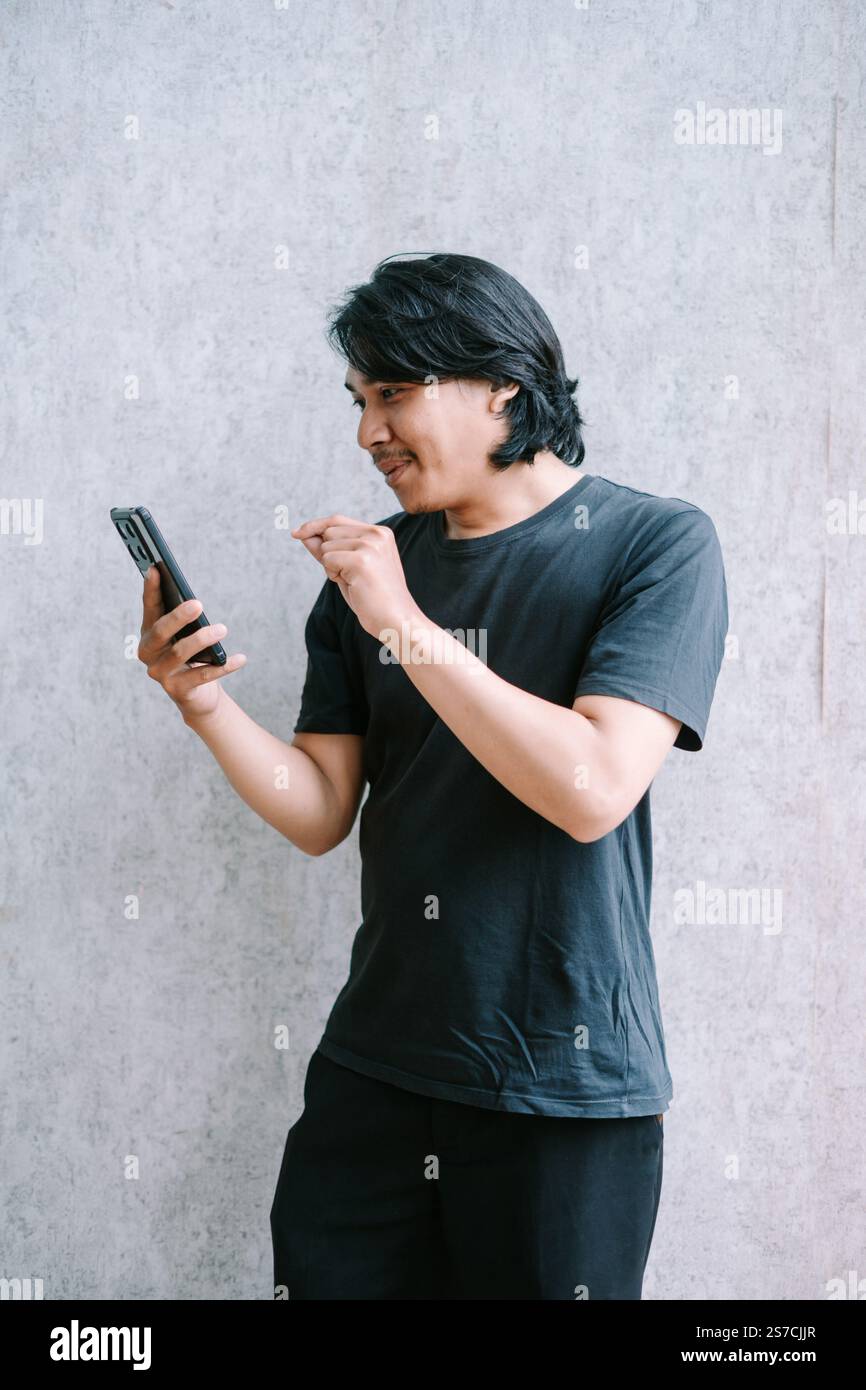 Young professional engaged smartphone hi-res stock photography and ...