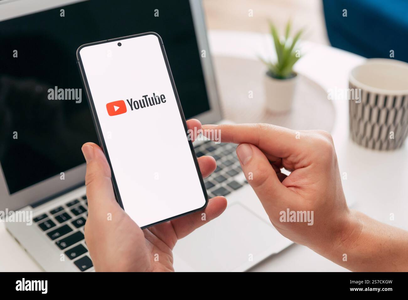Wroclaw, Poland - JAN 17, 2025: Man holding device with YouTube logo on ...