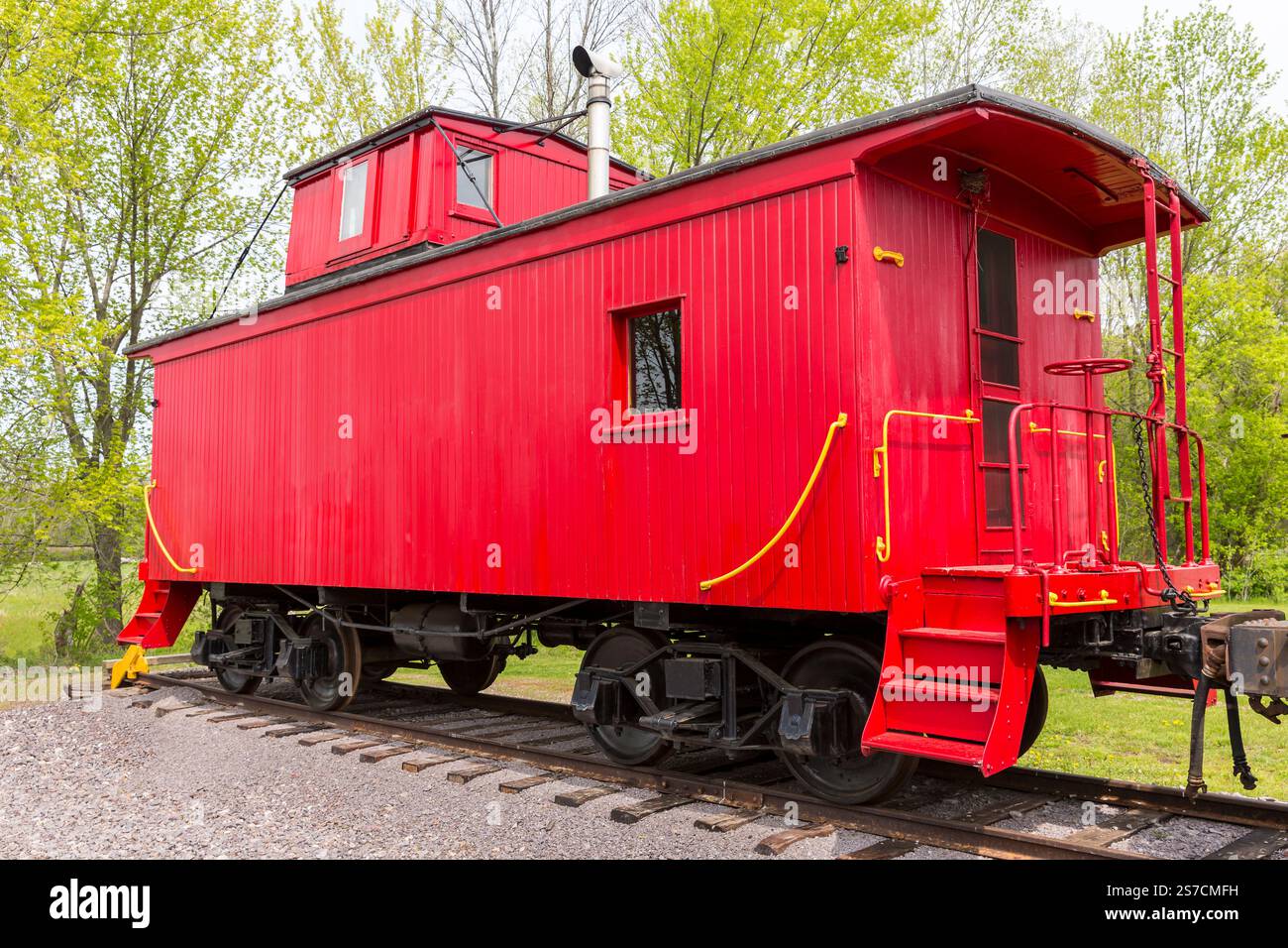 An old red wooden railroad caboose on track Stock Photo - Alamy