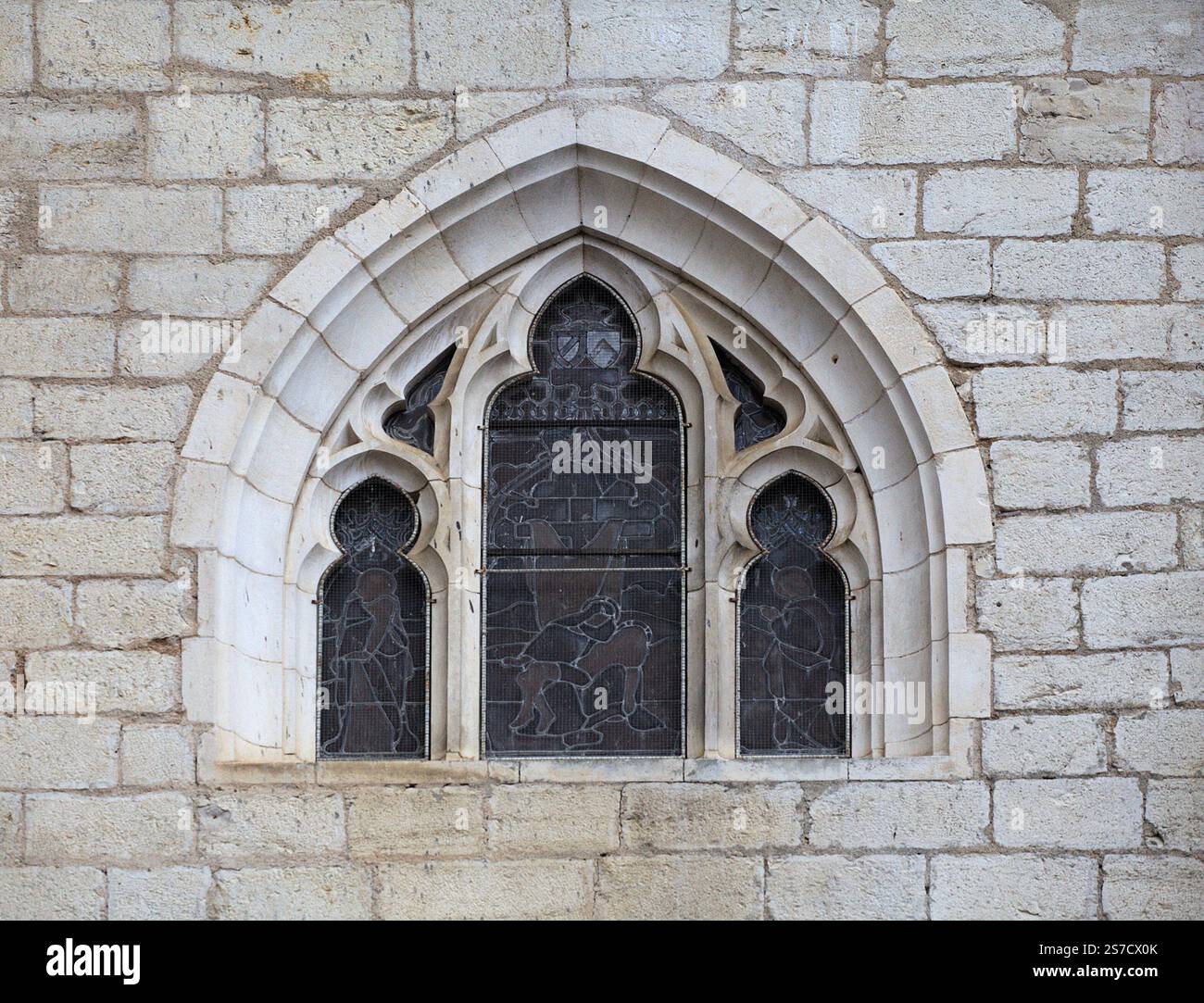 Stunning gothic window reveals intricate stonework and stained glass in ...