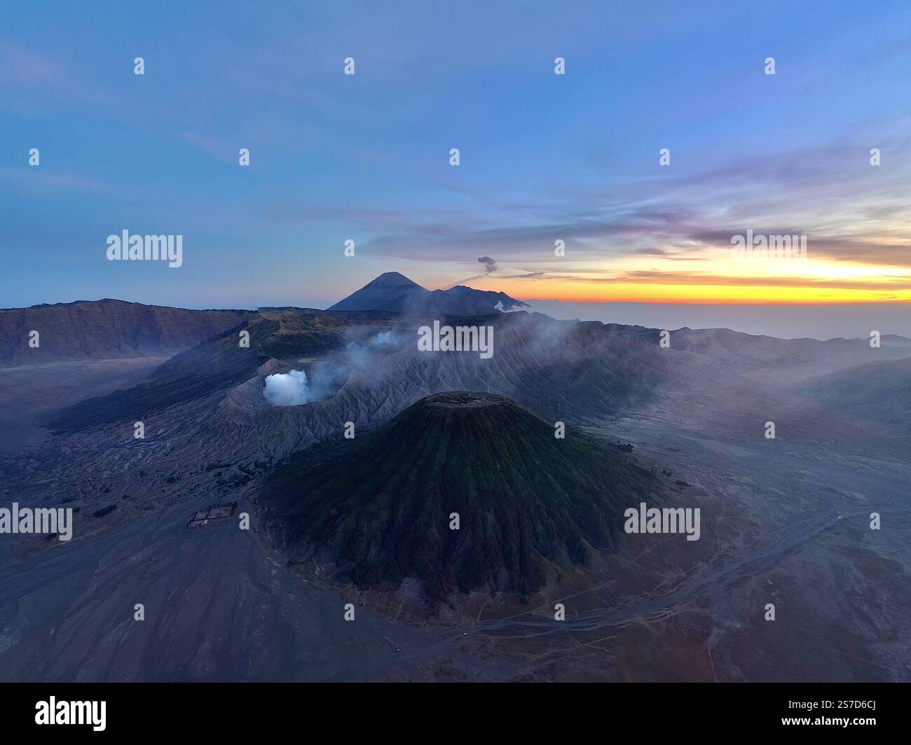 Aerial view of the smoking craters and the scenic beauty of the Bromo ...