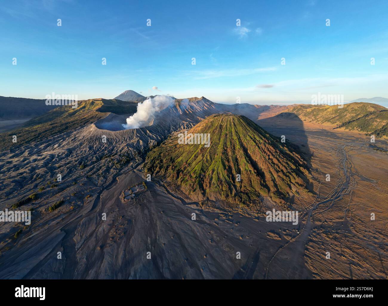 Aerial view of the smoking craters and the scenic beauty of the Bromo ...