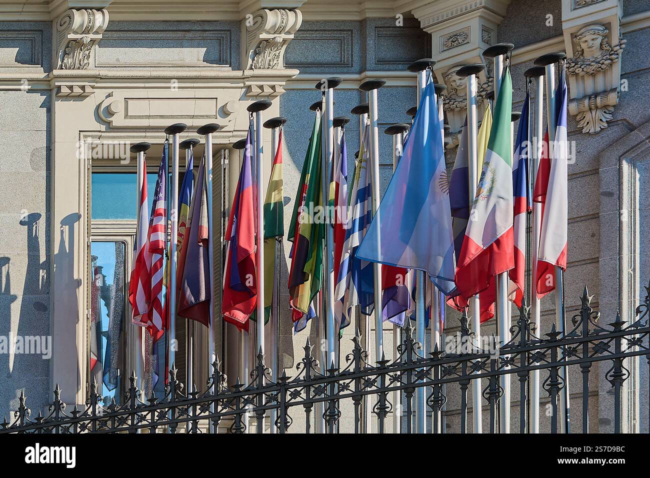Flags of different countries waving in front of an iconic building in ...