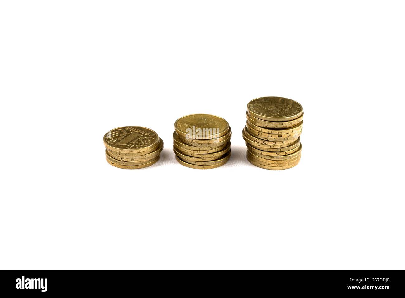 Three groups of coins are arranged in ascending order, showcasing their ...