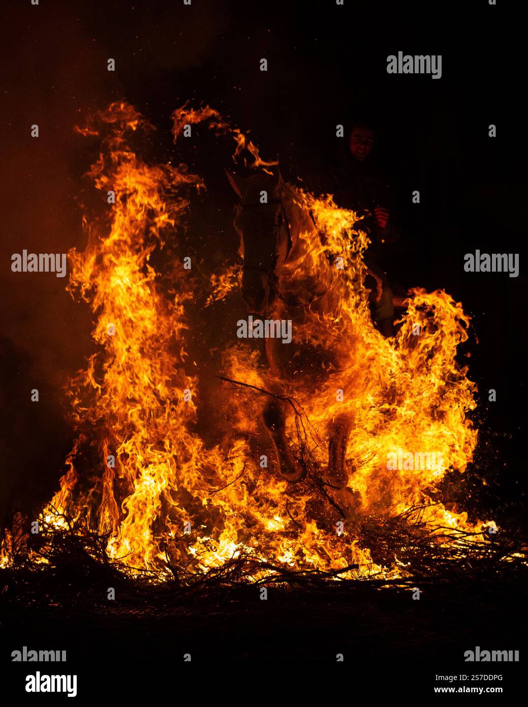 16 January 2025, Knights cross bonfires with their horses in an ancient ...