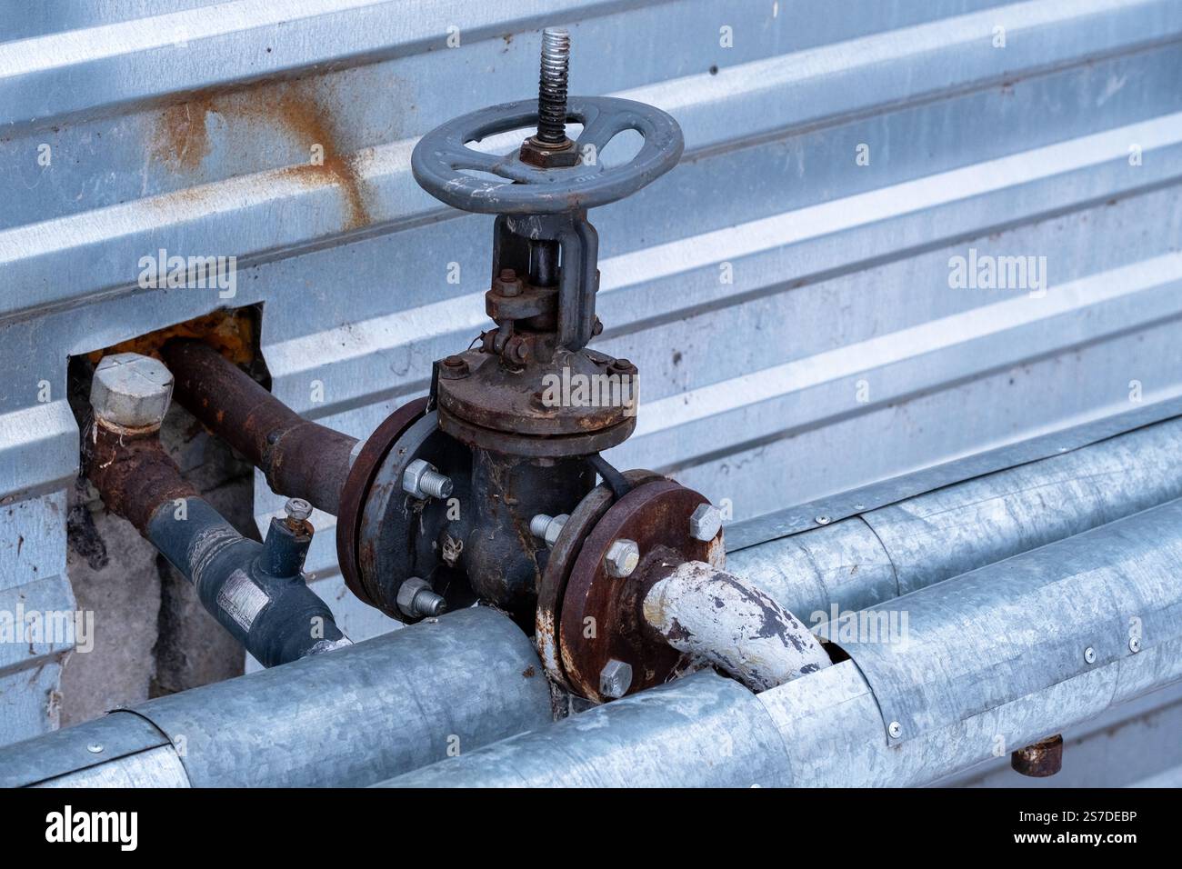 Utility pipes and valve for shutting off and opening water Stock Photo ...