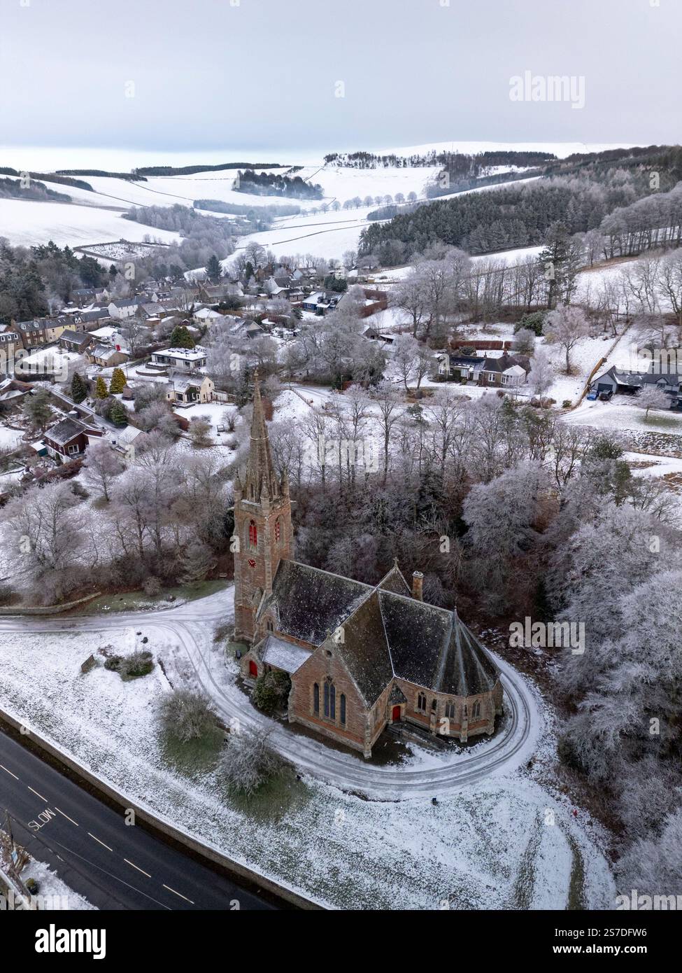 Aerial view of St Mary of Wedale church in village of snow covered Stow ...