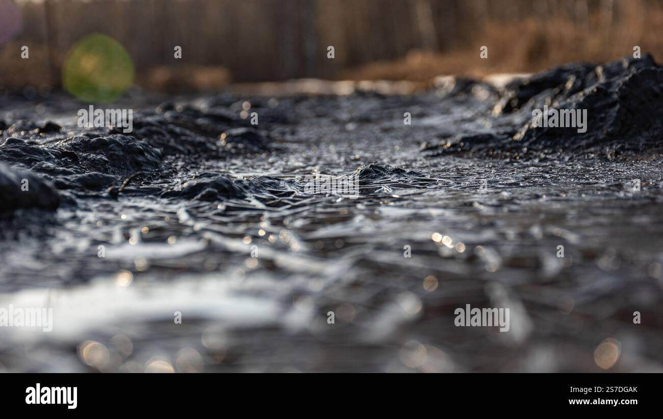abstract frozen ice texture on muddy swamp road, winter Stock Photo - Alamy