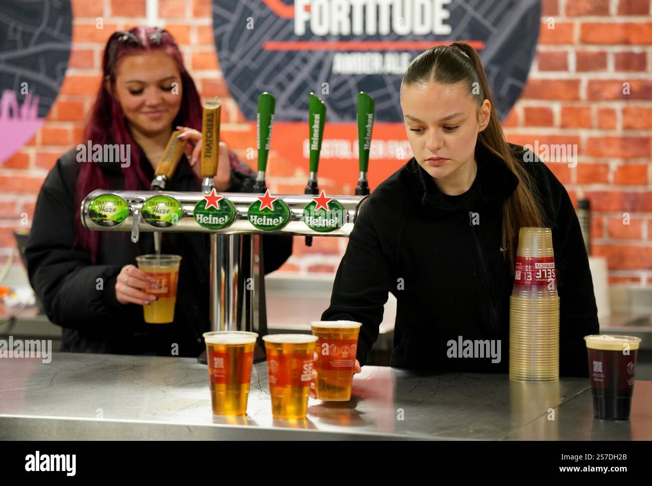 Staff pouring pints ahead of the Barclays Women's Championship match at ...