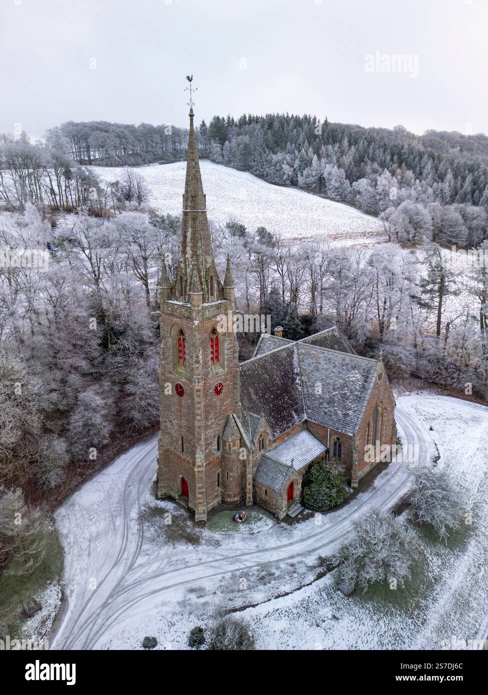 Aerial view of St Mary of Wedale church in village of snow covered Stow ...