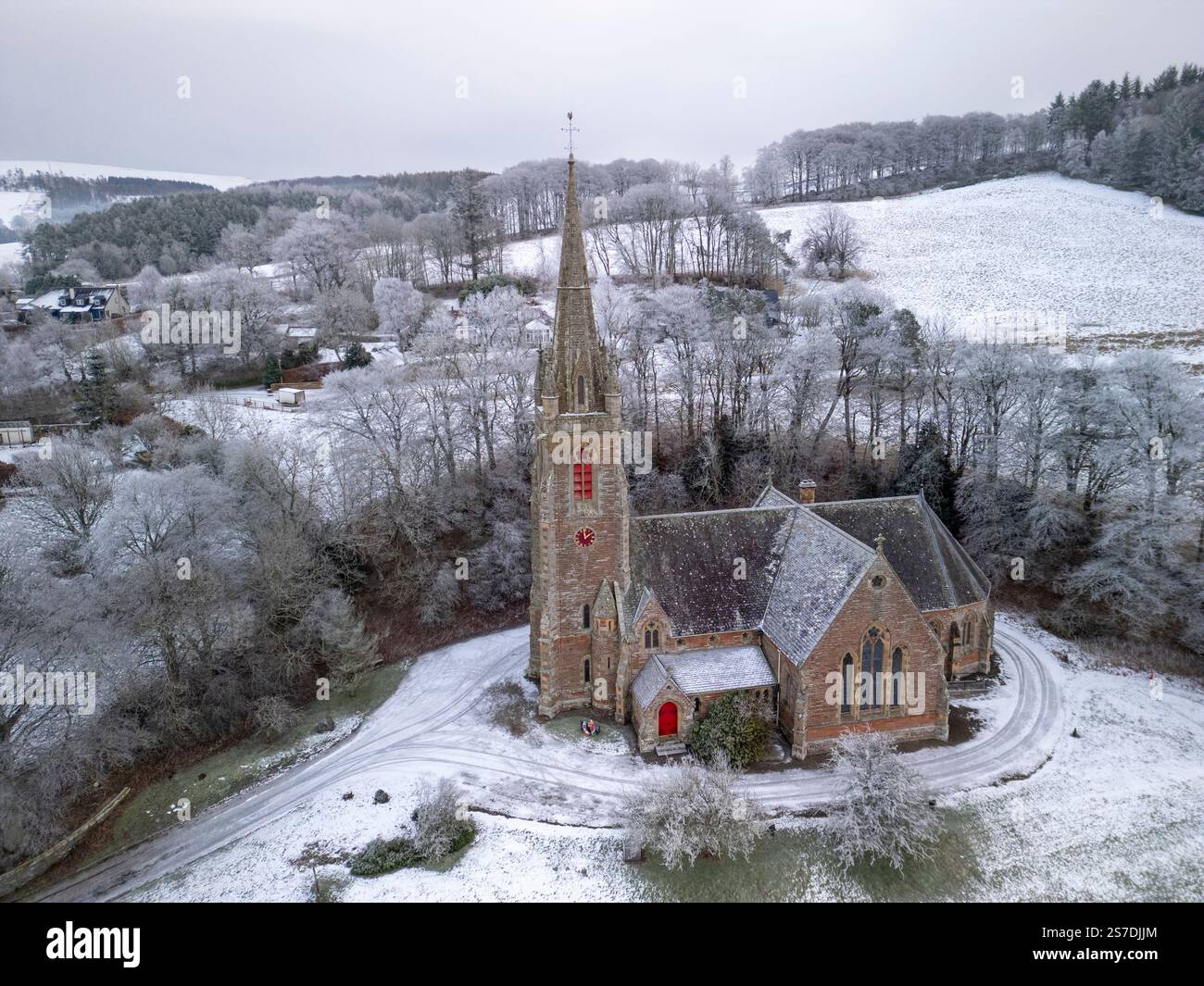 Aerial view of St Mary of Wedale church in village of snow covered Stow ...