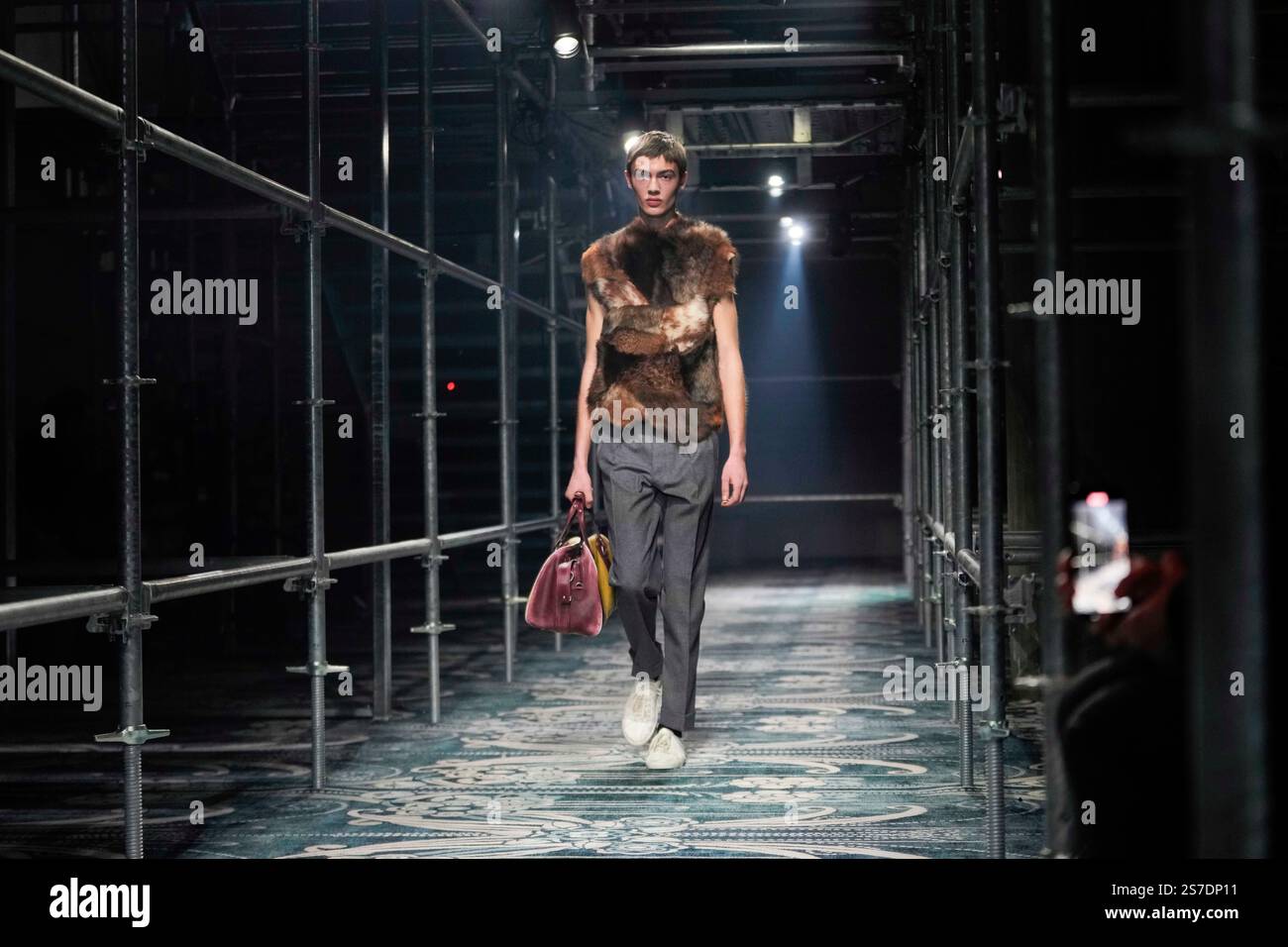 A model wears a creation part of the men's Prada Fall-Winter 2025-2026 ...