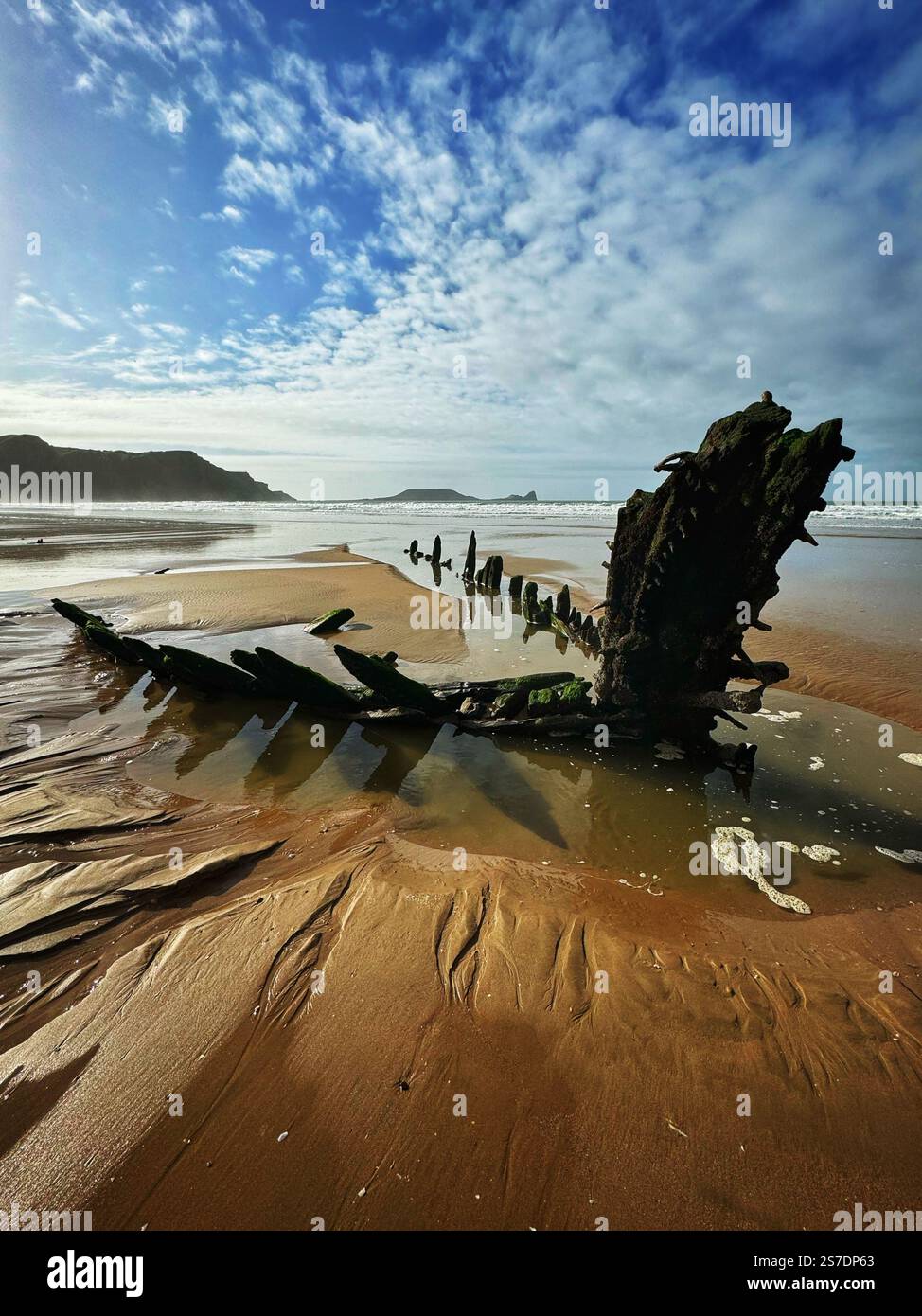 Rhossili beach with the wreck of the Helvetia and Worm's Head in the ...