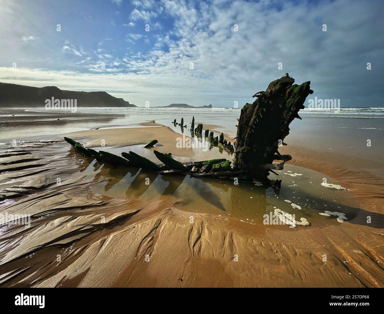 Rhossili beach with the wreck of the Helvetia and Worm's Head in the ...