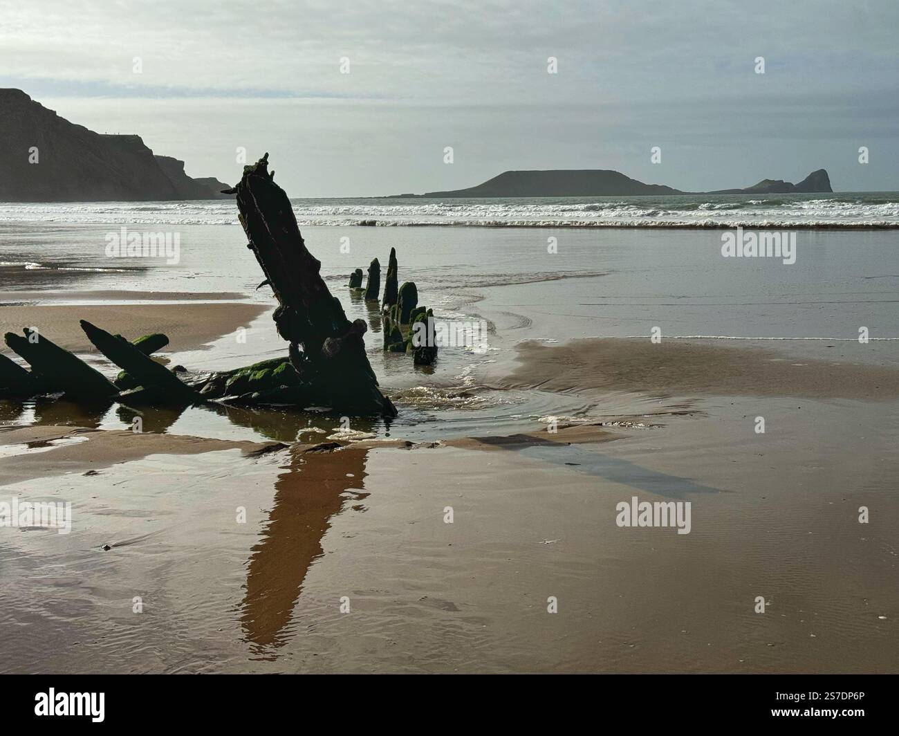 Rhossili beach with the wreck of the Helvetia and Worm's Head in the ...