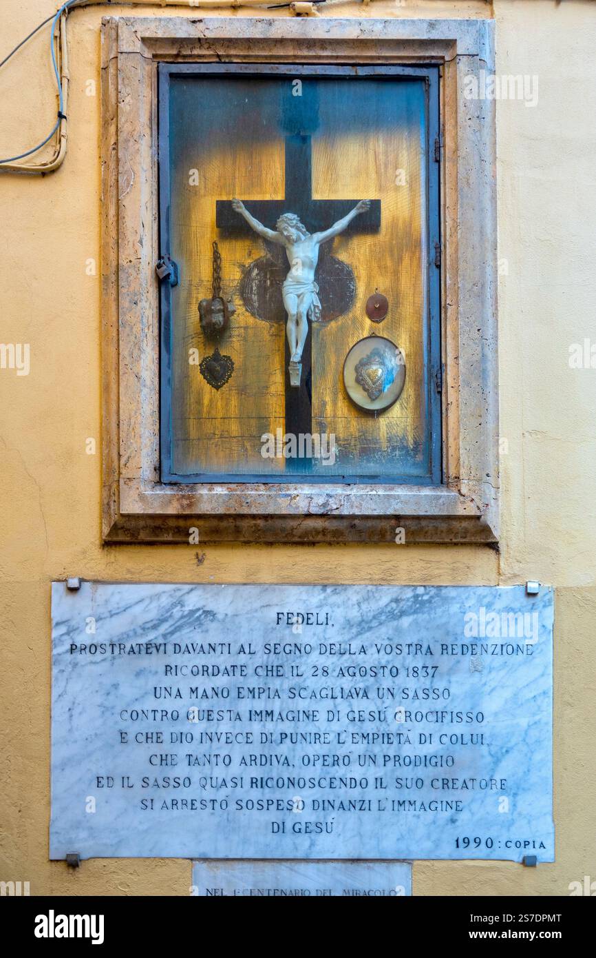 Marble crucifix in a niche at Piazza del Crocifisso, Pisa, Italy ...