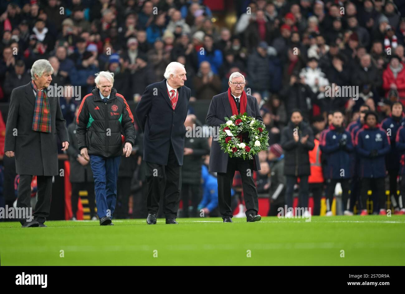 Sir Alex Ferguson (right) observes a tribute to the late Denis Law ...
