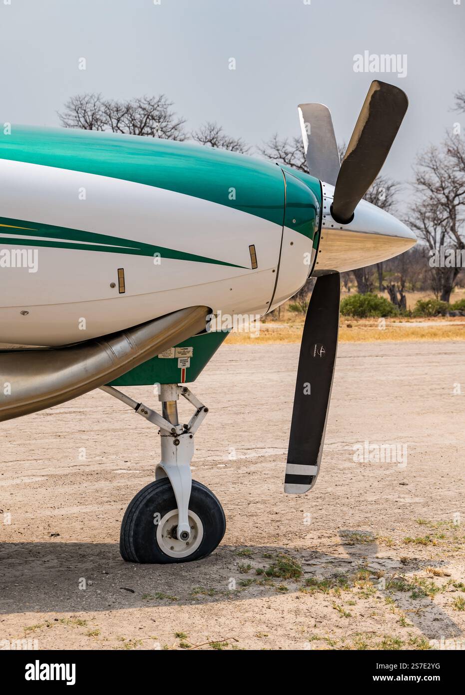 Tourist transport aeroplane with flat tyre, Moremi airstrip, Botswana ...