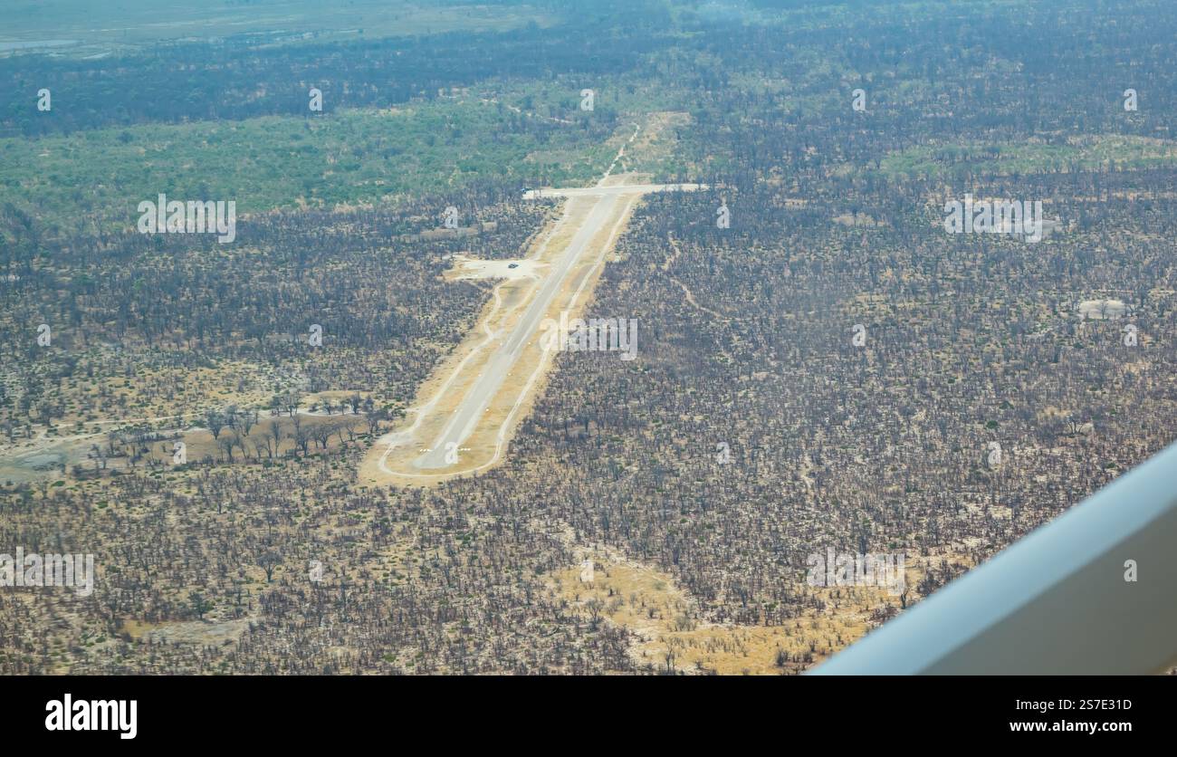 Aerial view from above of dirt runway, Moremi game reserve airstrip ...
