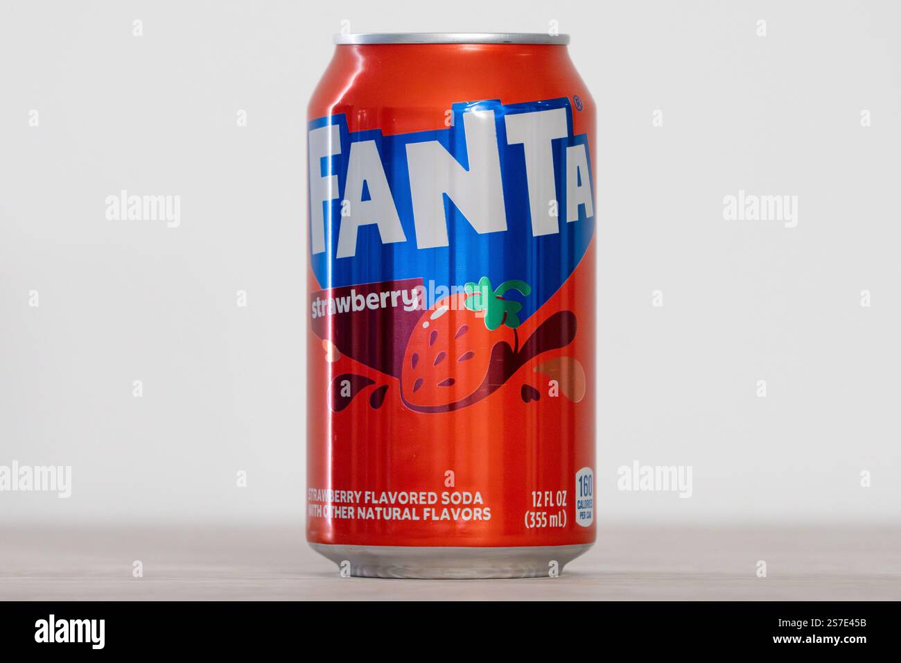 Fanta strawberry flavored soda against a white background. Red beverage ...