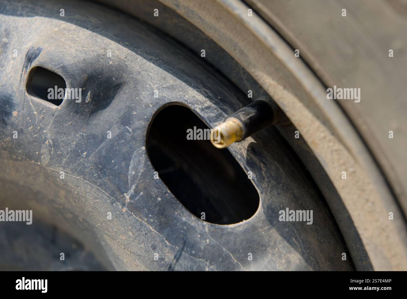This image captures a detailed view of a vehicle's wheel, focusing on ...