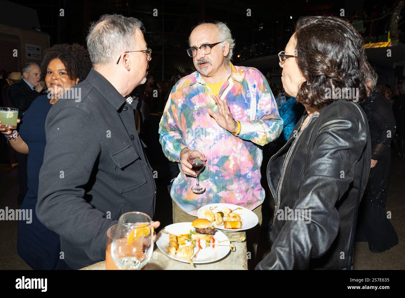 Journalist Sam Husseni speaks with attendees of the Busboys and Poets ...