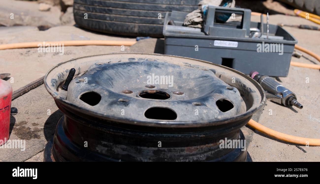 This image shows a close-up view of a car wheel rim removed from a tire ...
