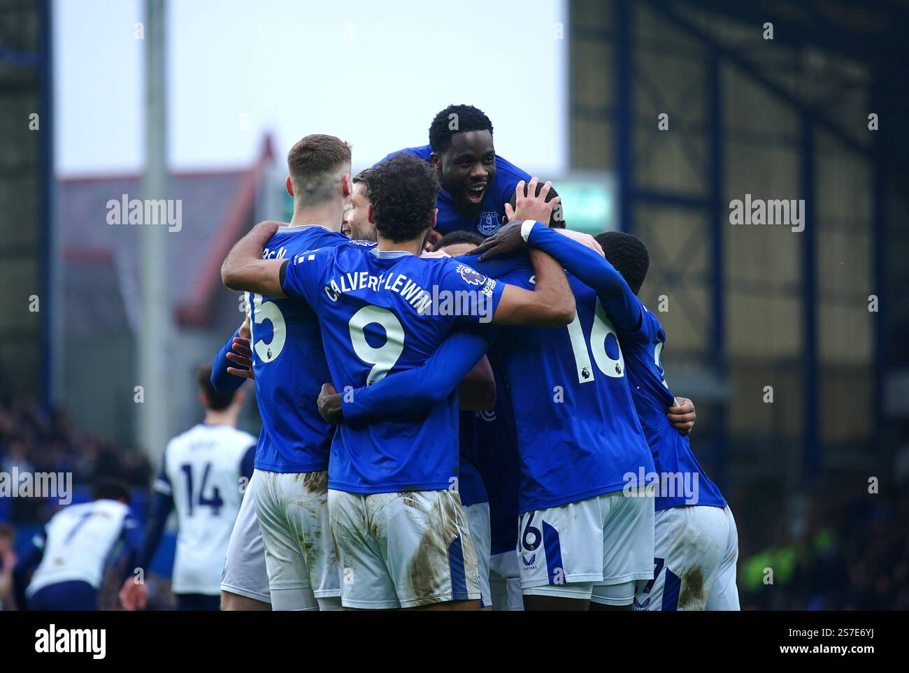 Everton players celebrate their side's third goal of the game, an own ...