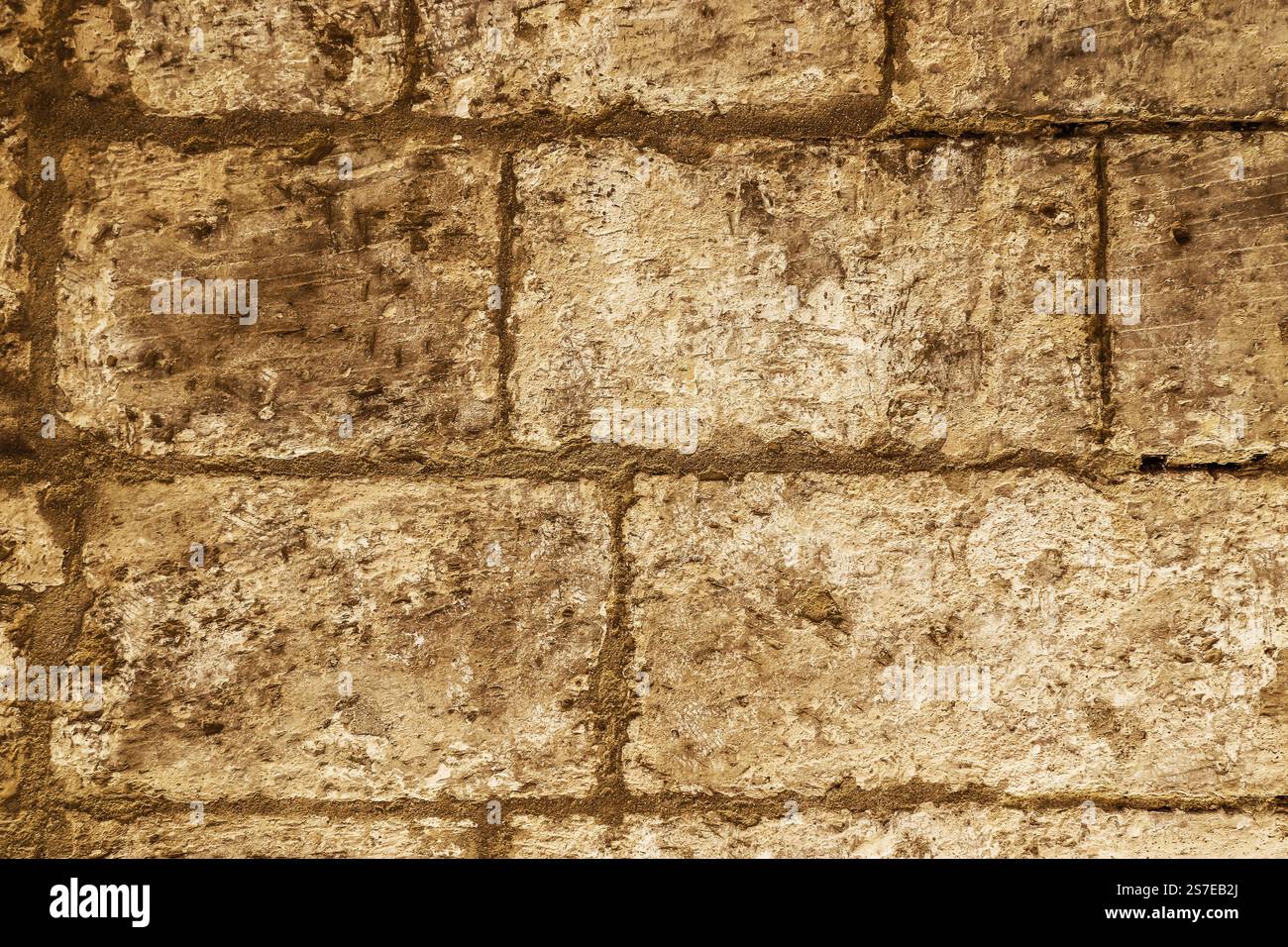 The rustic surface of a stone wall lining Malta's historic passageways ...