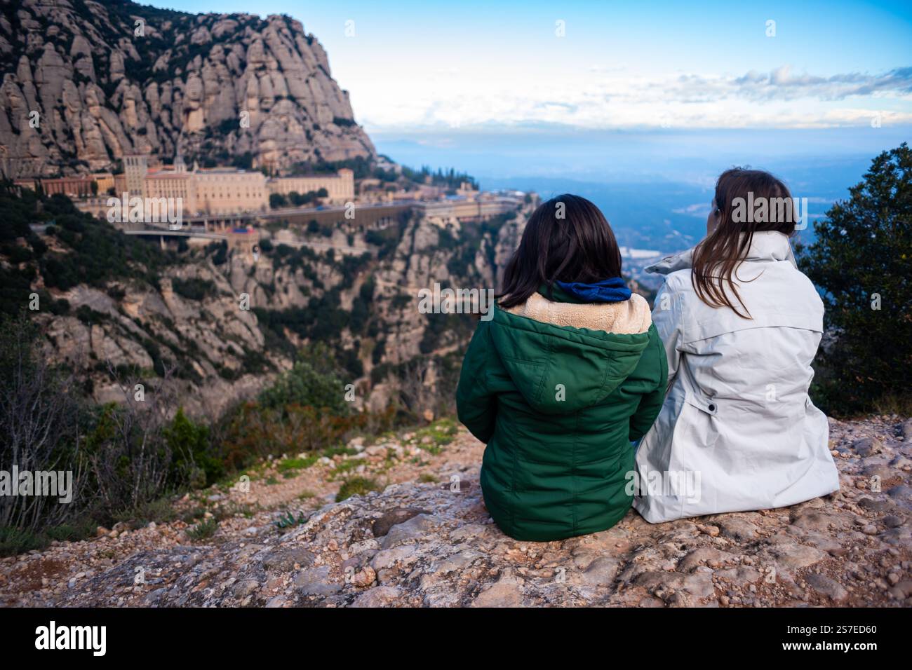 Two women contemplating the impressive views of Montserrat and its ...