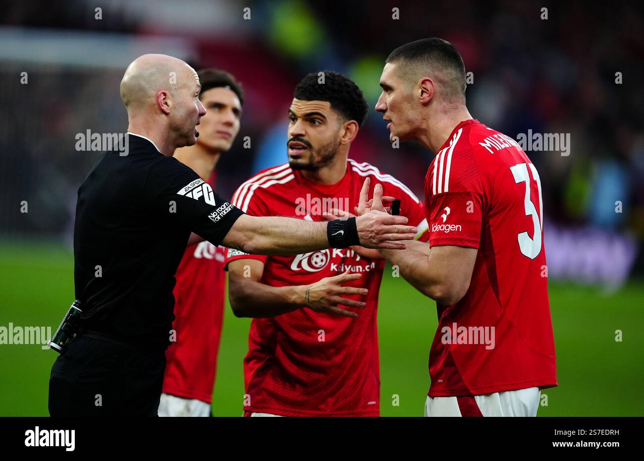 Referee Anthony Taylor speaks to Nottingham Forest's Morgan Gibbs-White ...