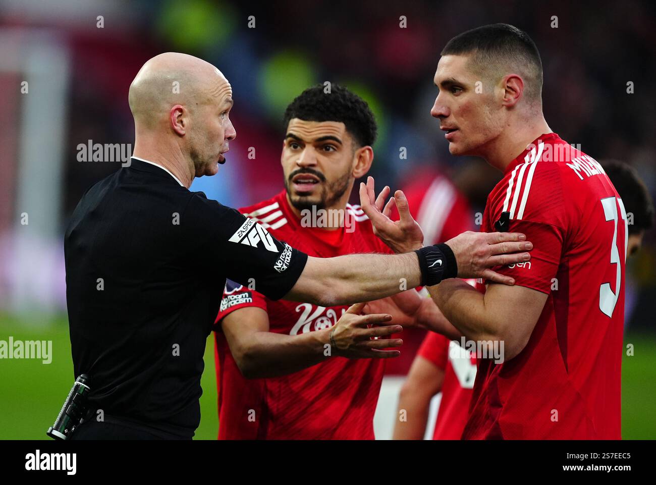 Referee Anthony Taylor speaks to Nottingham Forest's Morgan Gibbs-White ...