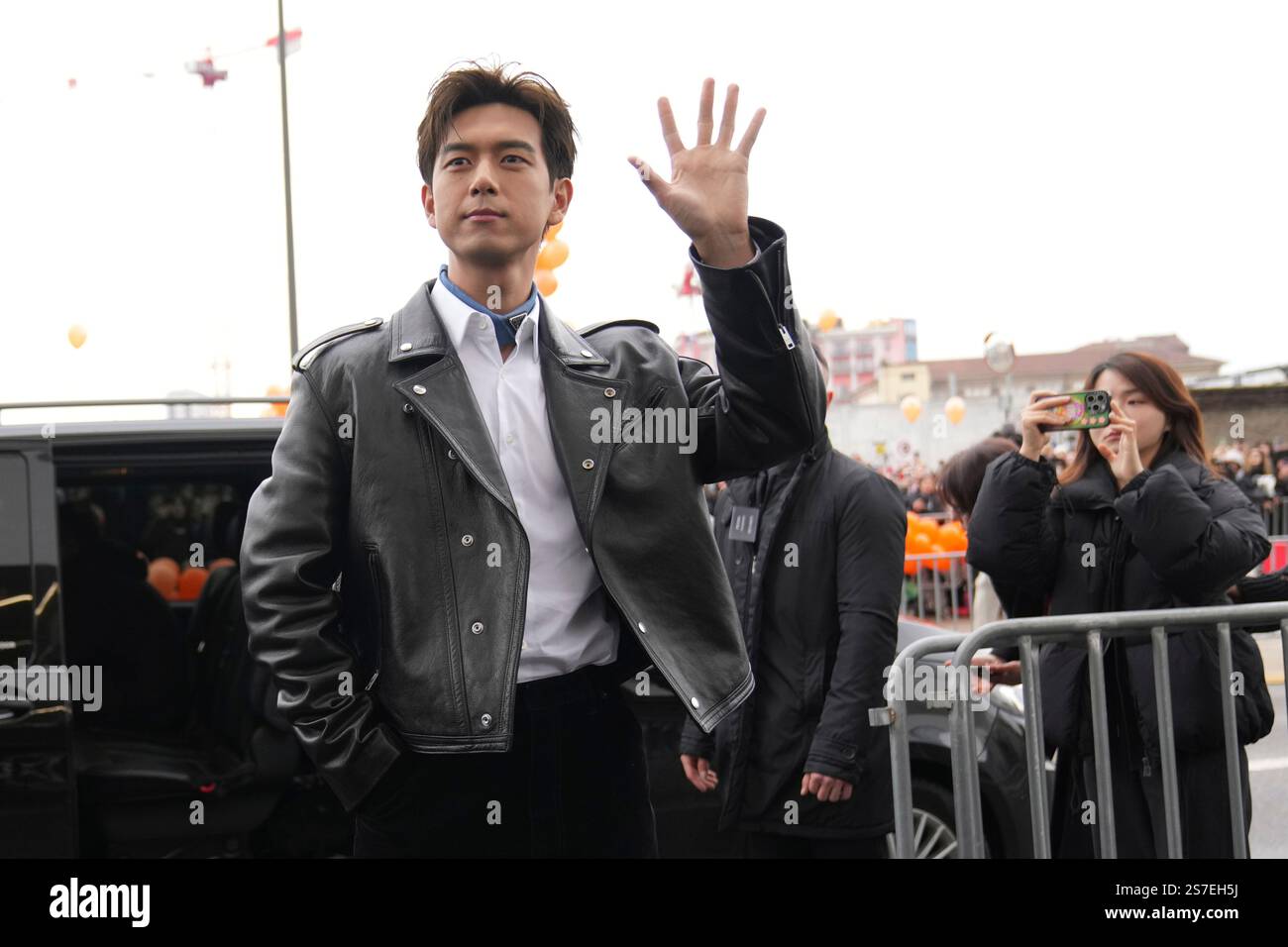 Li Xian arrives as he attends at the men's Prada Fall-Winter 2025-2026 collection show, that was ...