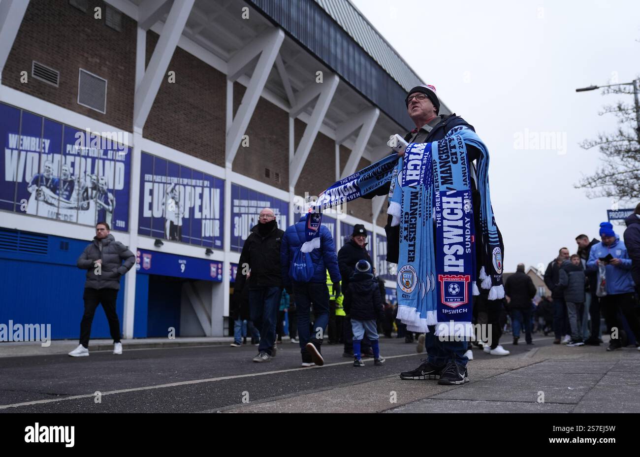 A vendor sells scarves outside ahead of the Premier League match at ...