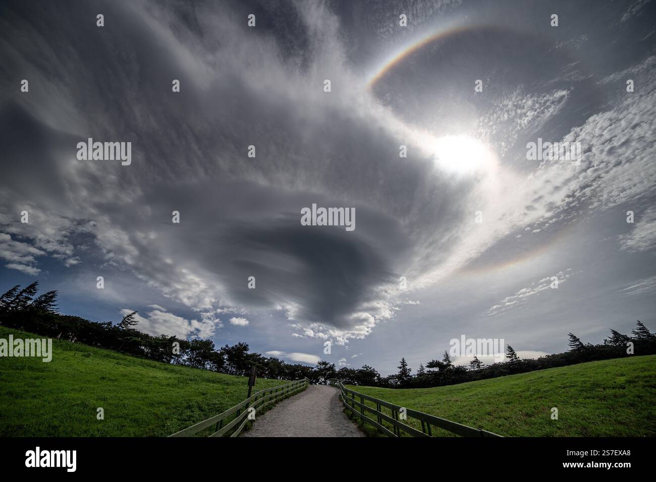 Ranch views spread under spectacular clouds and rainbows in the sky ...