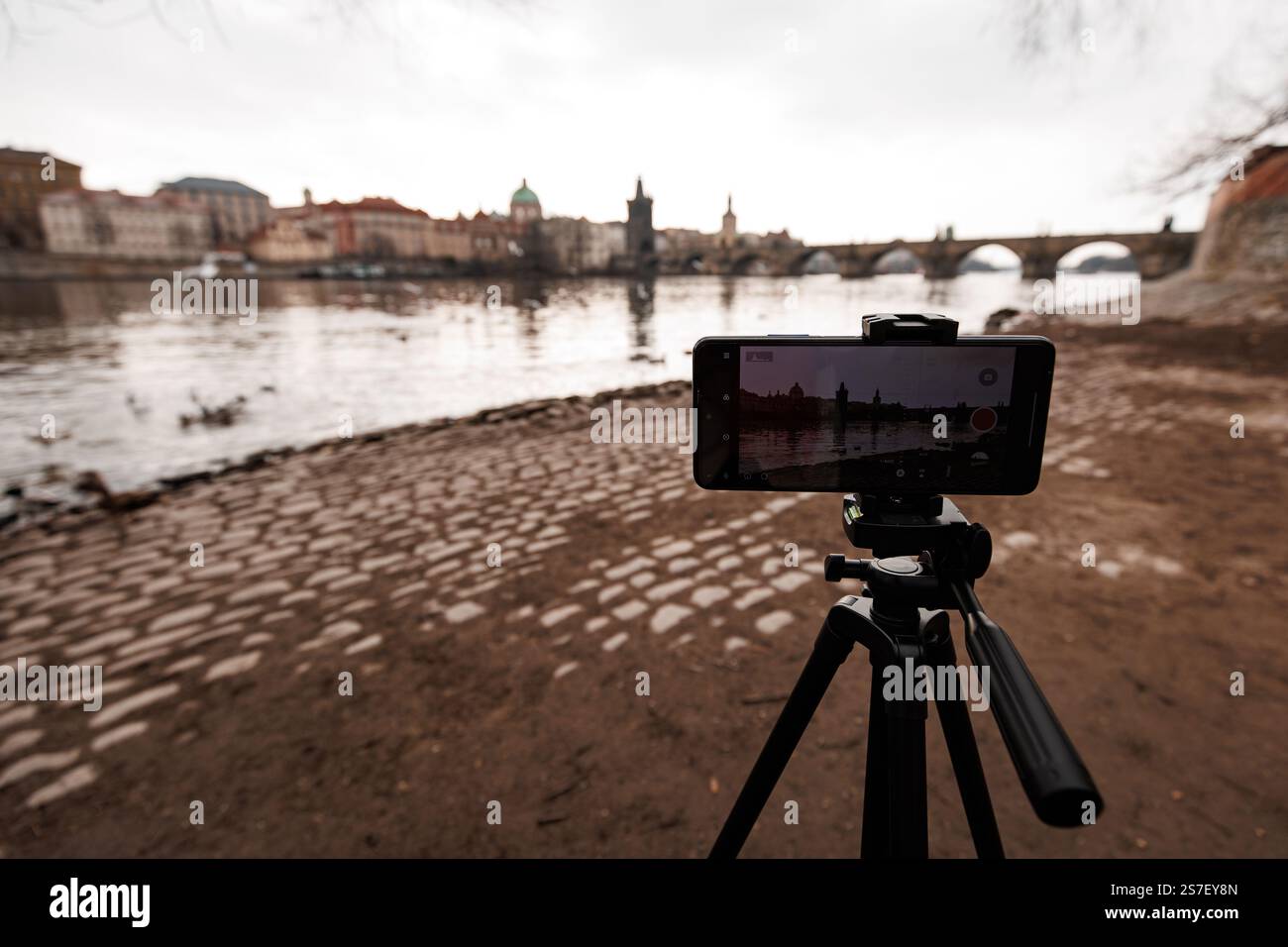 Modern smartphone mounted on tripod capturing stunning time lapse of ...