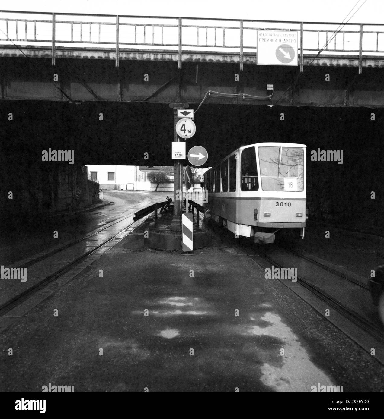 Tram passes under a railway overpass, Kozloduy str., Sofia, Bulgaria ...