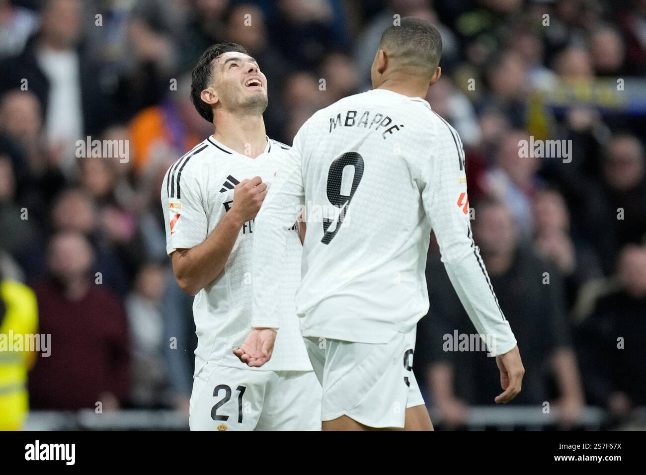 Real Madrid's Brahim Diaz, left, celebrates after scoring his side's ...