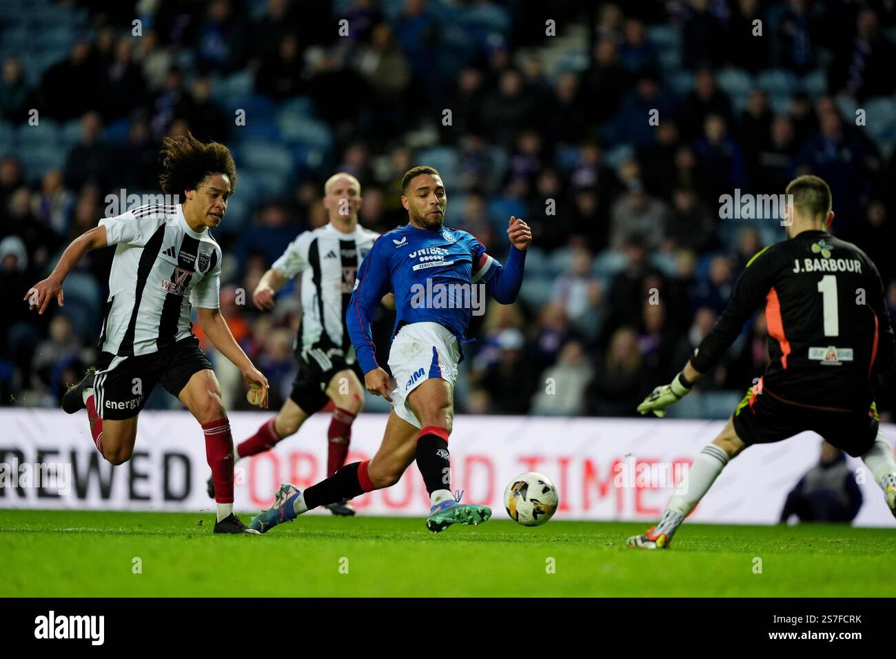 Rangers' Cyriel Dessers (second right) rounds Fraserburgh goalkeeper ...