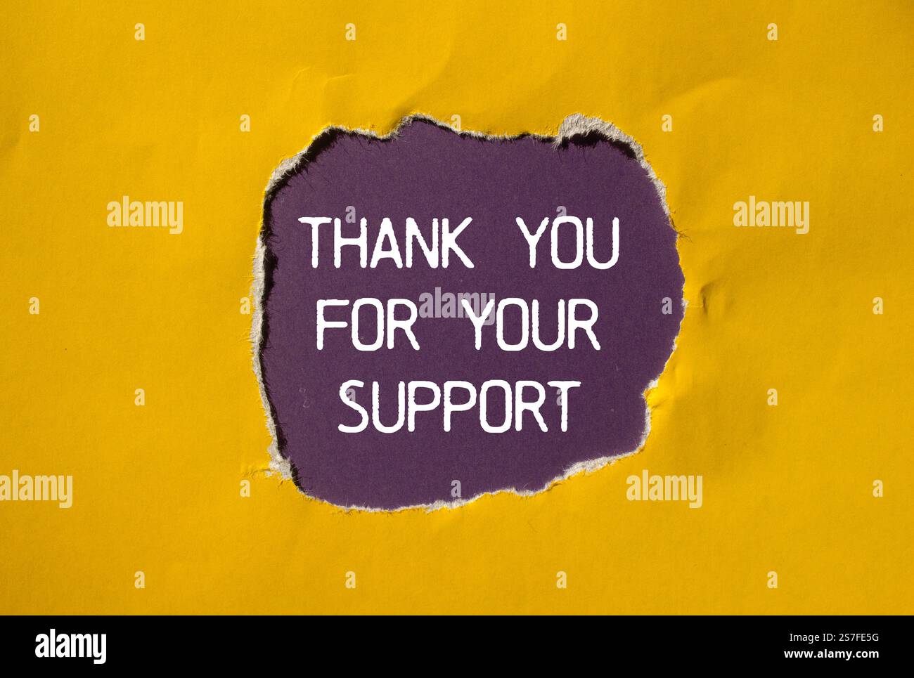 Thank you for your support message written on ripped torn yellow paper ...