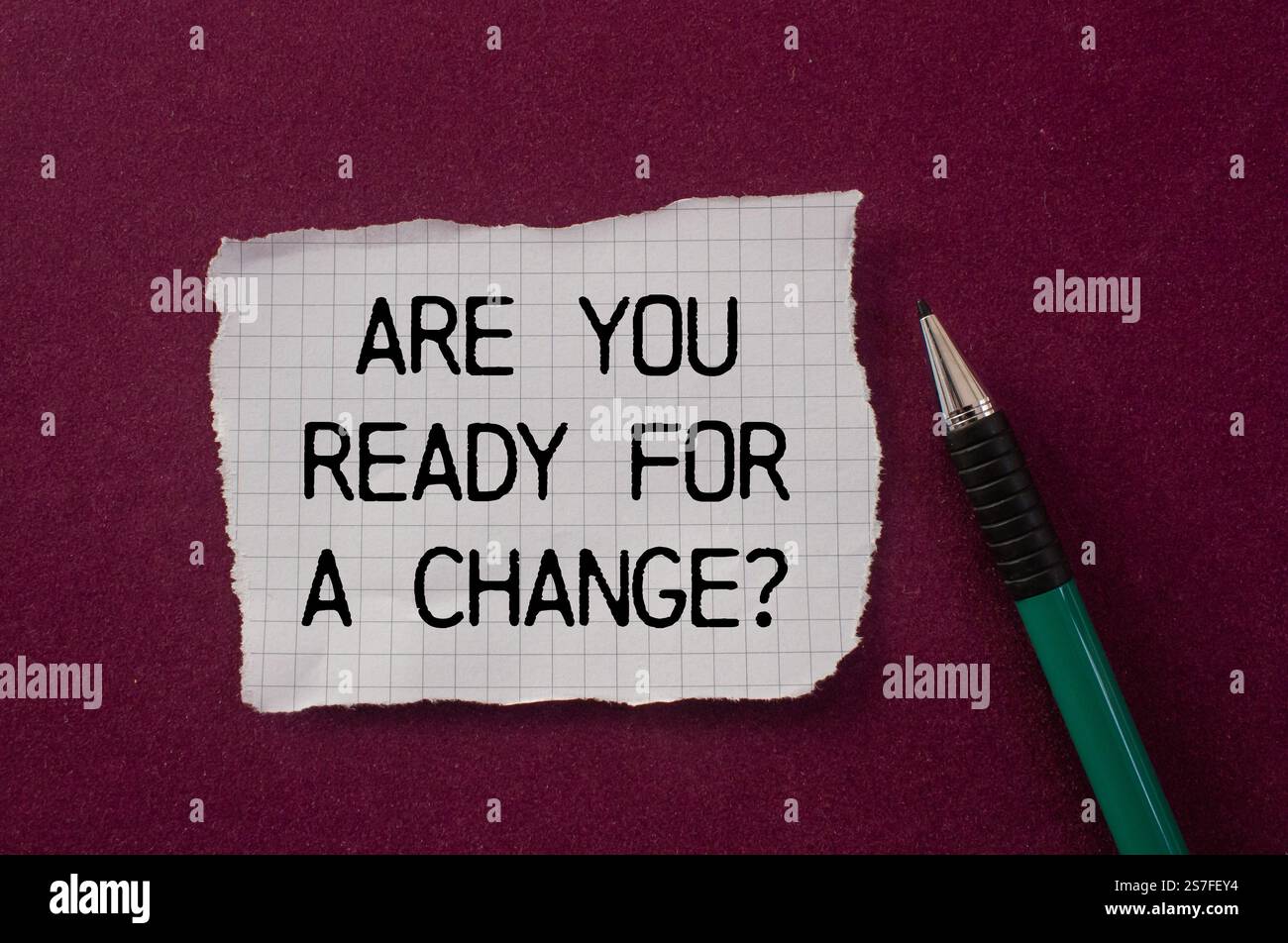 Are you ready for a change message written on ripped torn paper piece with purple background ...