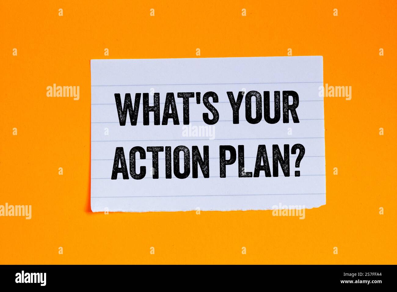 What's your action plan message written on ripped torn white paper piece on orange background ...