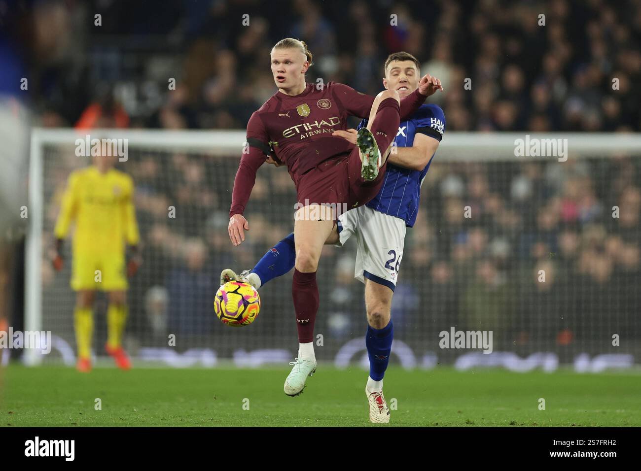 Manchester City's Erling Haaland, left, and Ipswich Town's Dara O'Shea ...