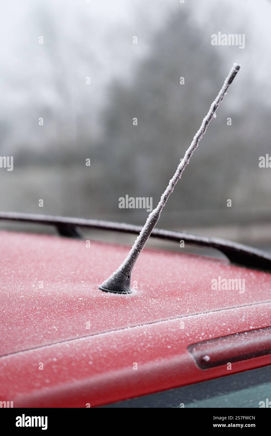 Frozen roof with antenna on car. Concept for winter time and ...